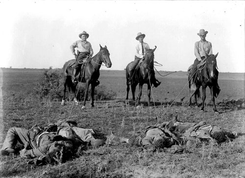 Texas Rangers with dead Mexicans, 1915. Photo by Robert Runyon.